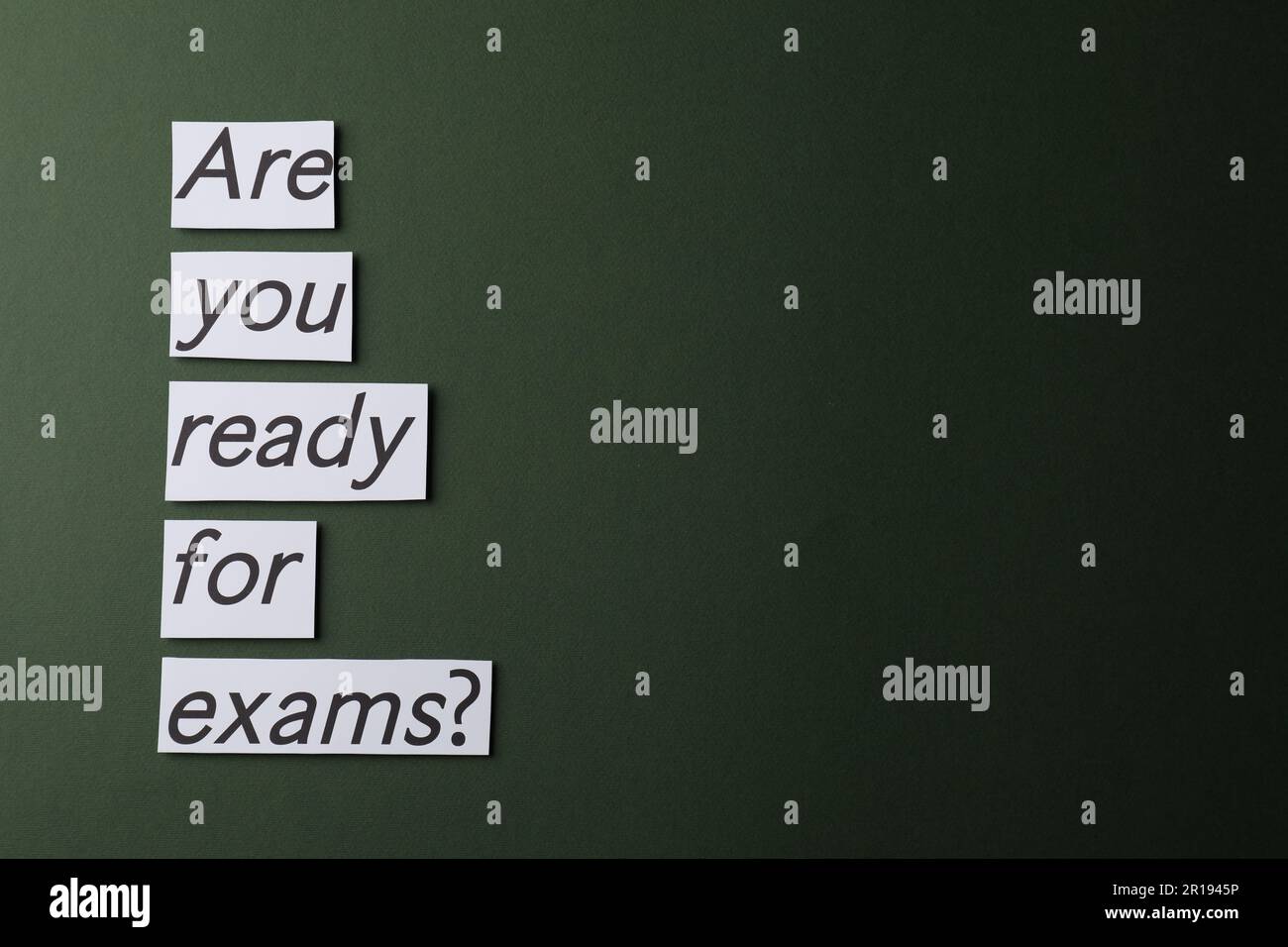 Notes with words Are you ready for exams on dark green background ...