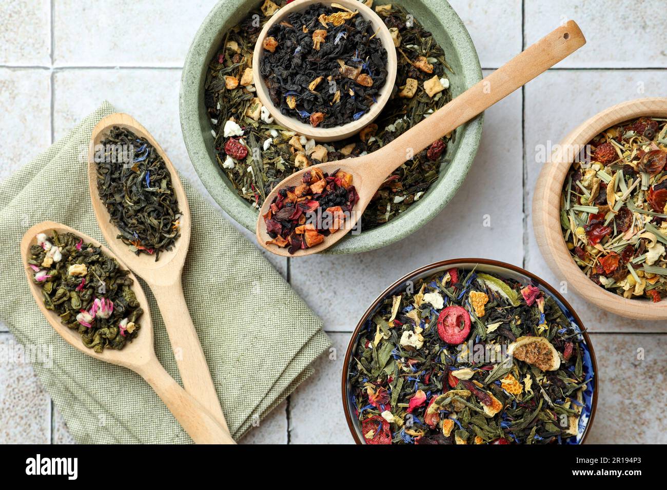Many different herbal teas on white tiled surface, flat lay Stock Photo ...