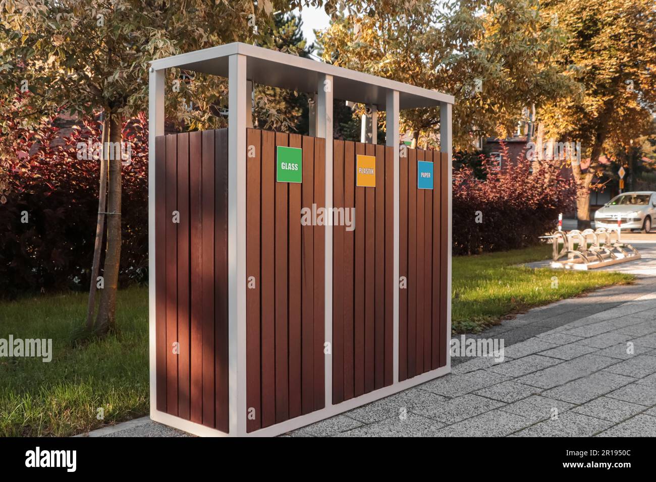 Different sorting bins for waste recycling on sunny day outdoors Stock ...