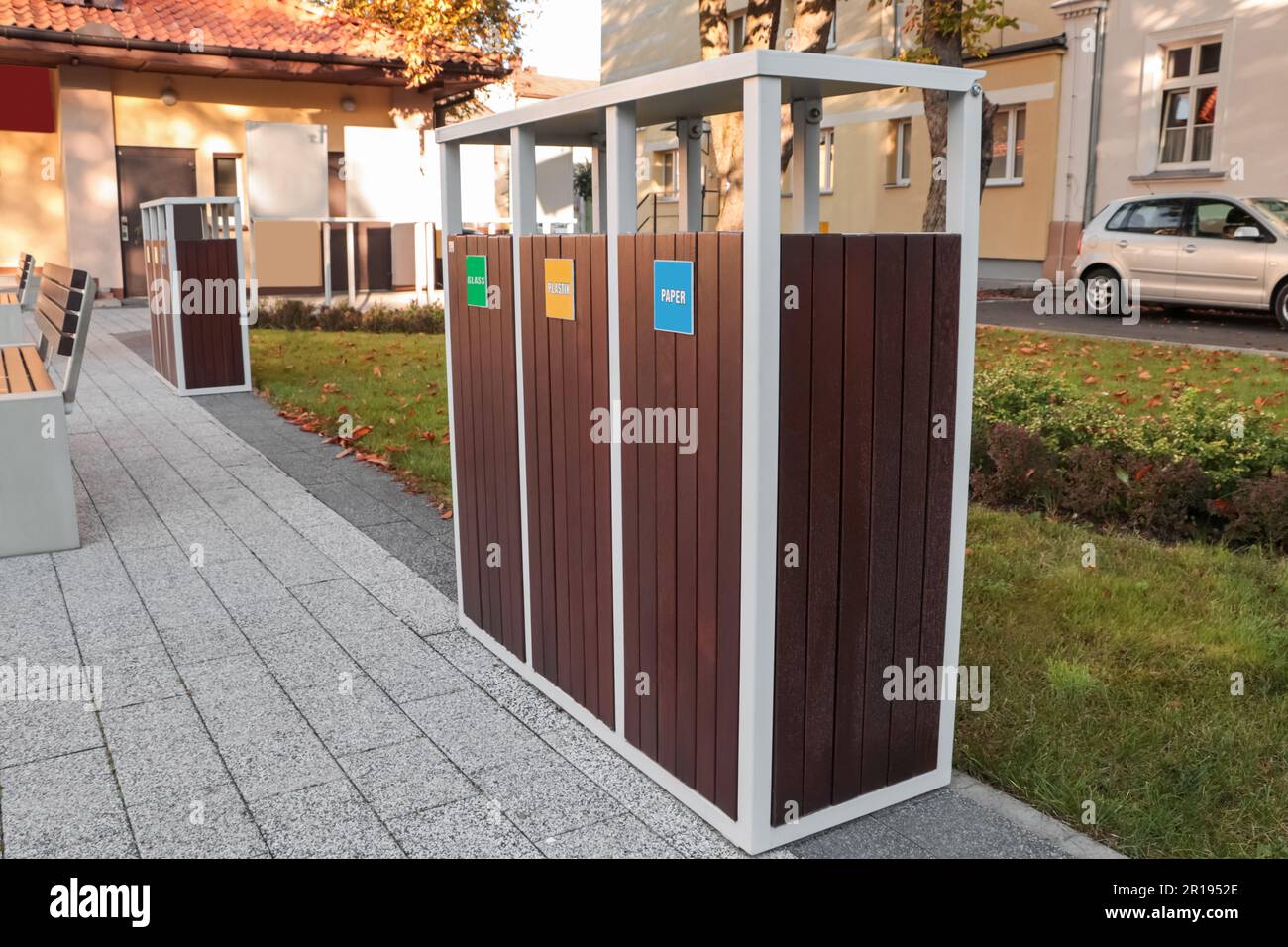 Different sorting bins for waste recycling on city street outdoors ...