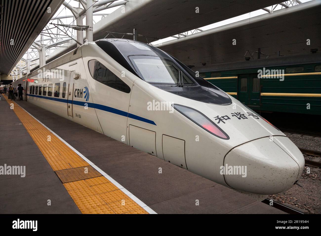Chinese CRH5 High Speed Rail HSR fast train waiting at platform of ...