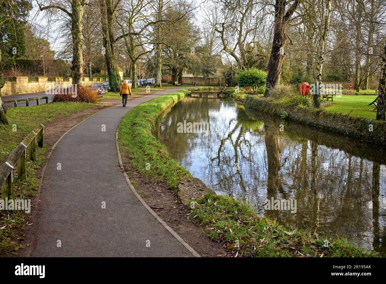 Lower Slaughter Cotswolds. River Eye winding through the village ...