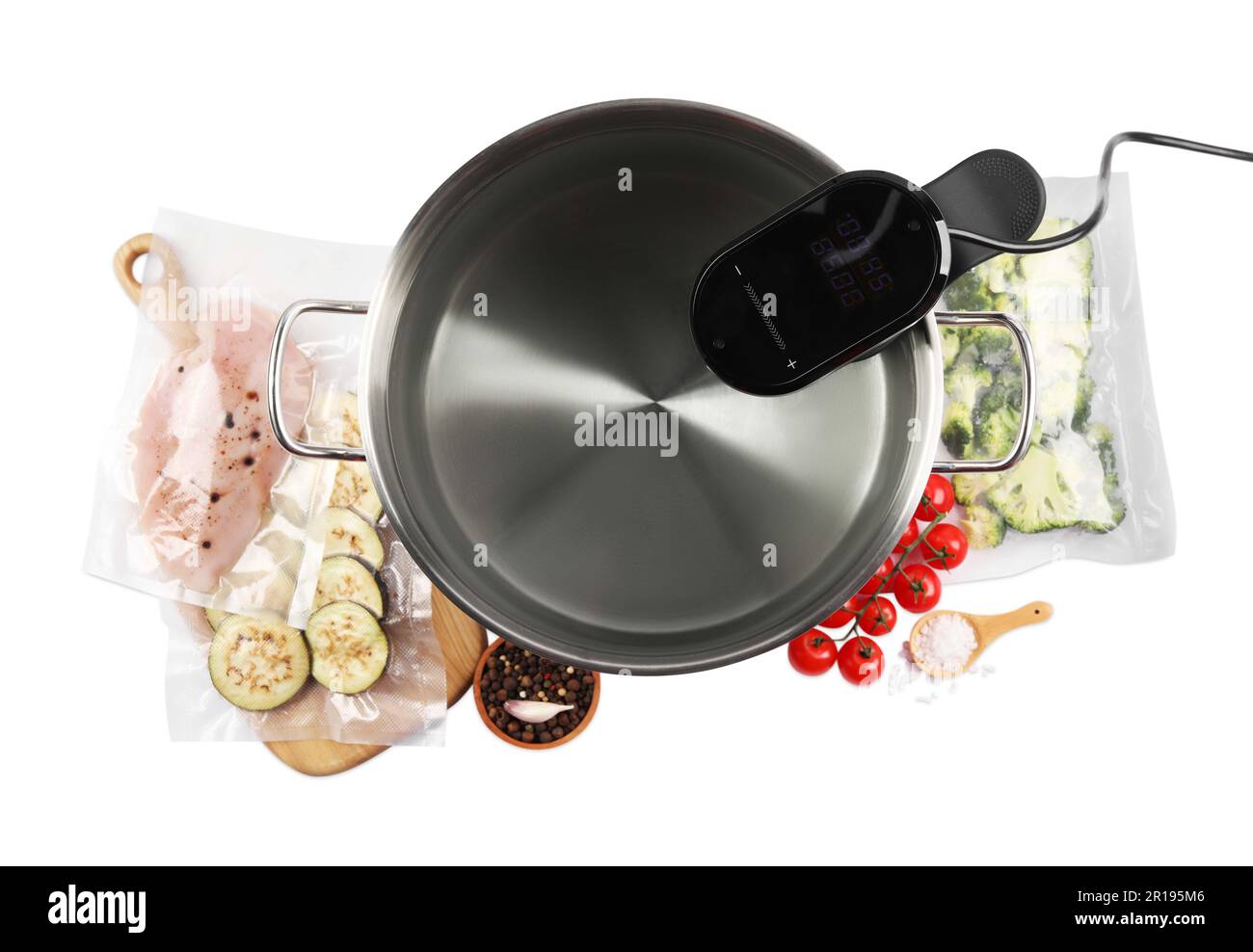 Thermal immersion circulator in pot and ingredients on white background ...