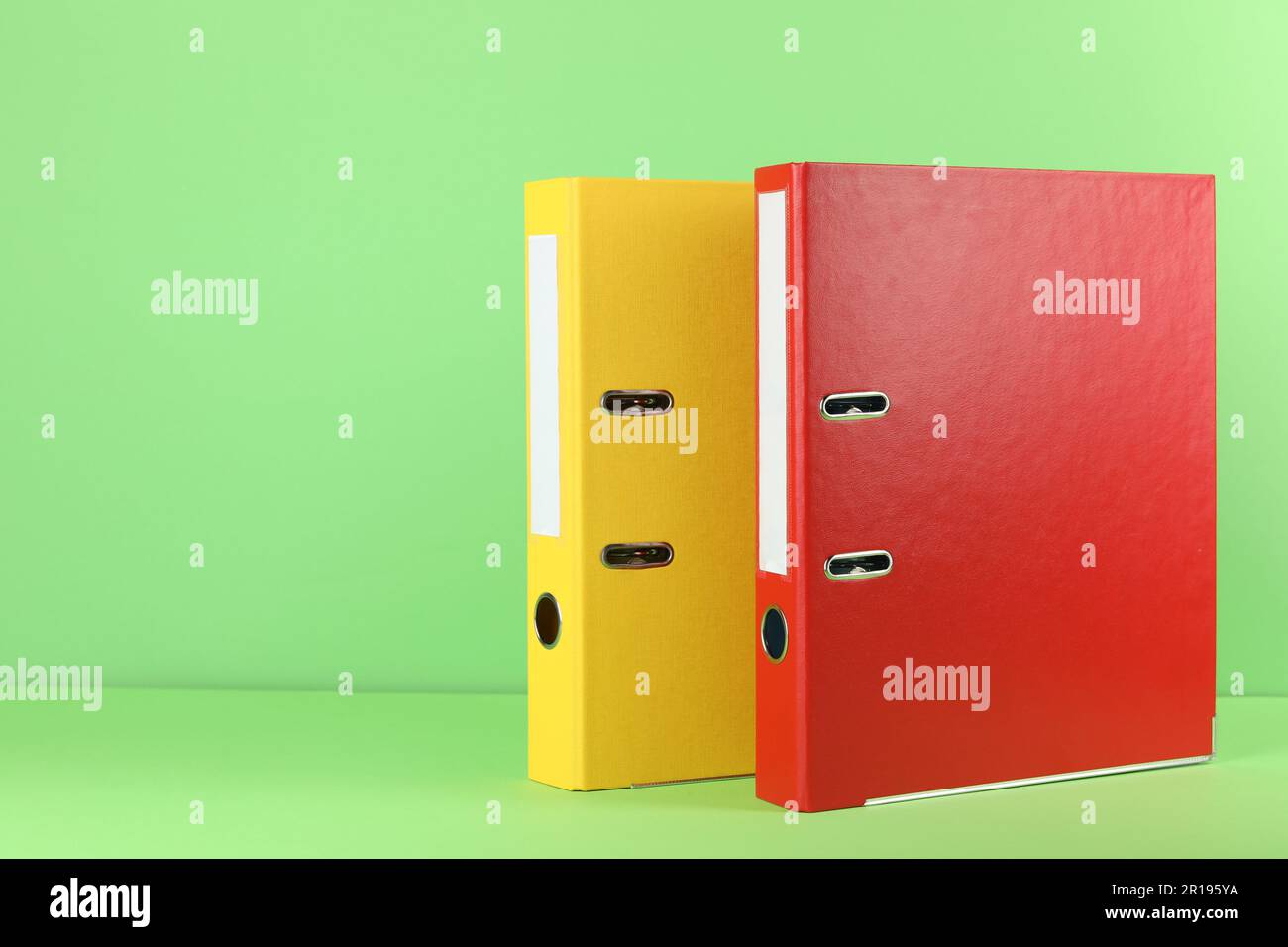 Office folders on light green background, space for text Stock Photo ...