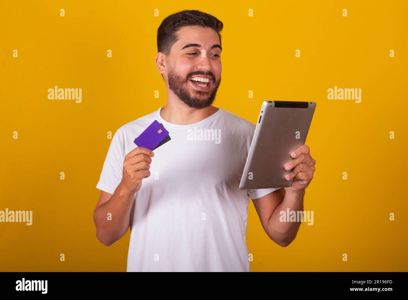 Brazilian Latin American Man, Surprised and Happy, Holding Tablet and ...