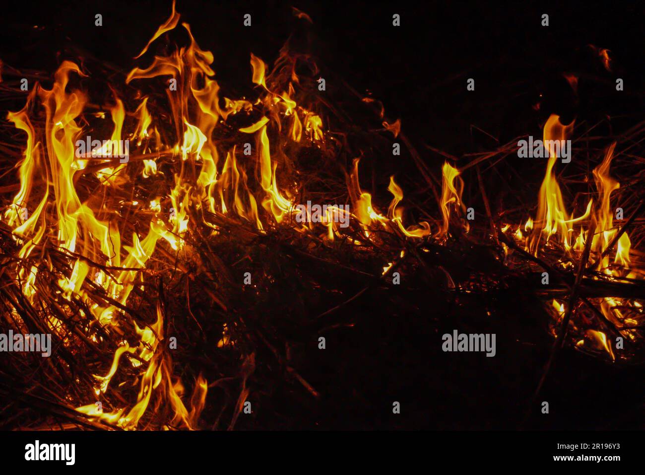 Heat energy heap closely. Burning red hot sparks fly from large fire in ...