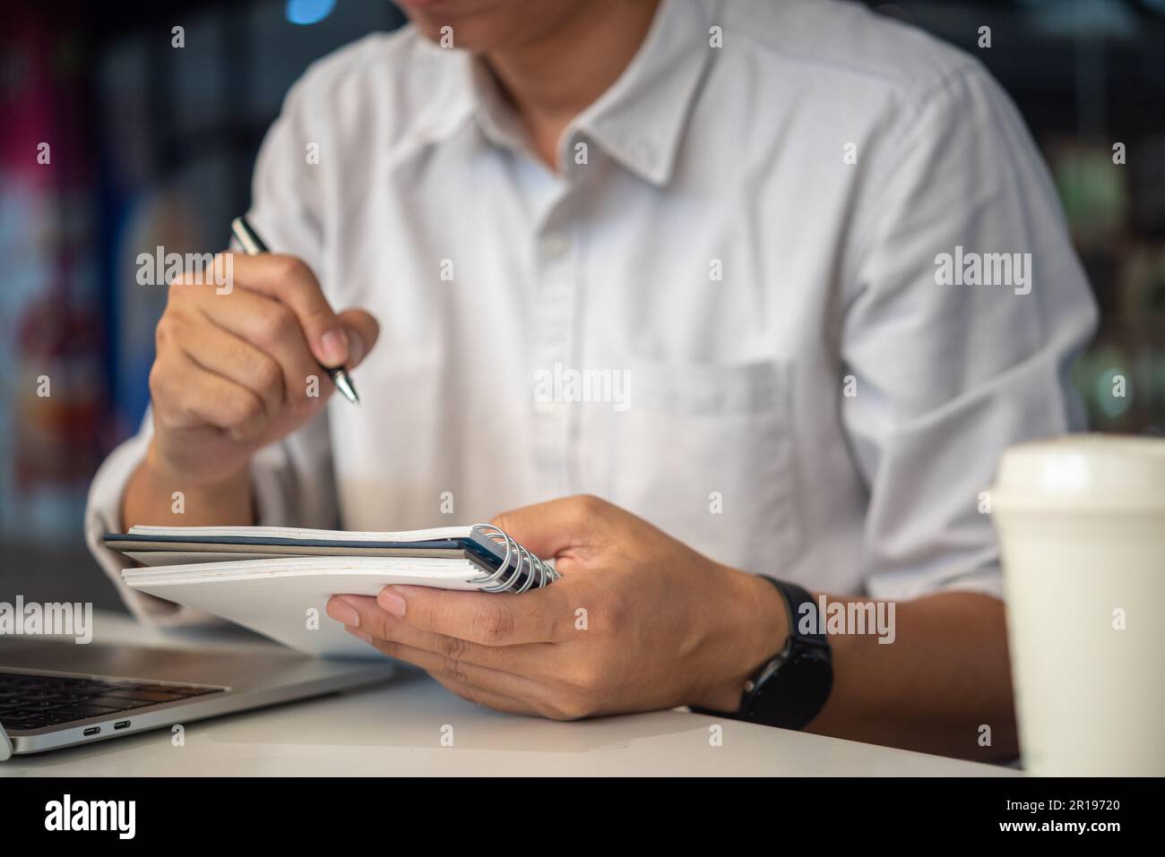 Businessperson reading and writing on book.education studying knowledge ...