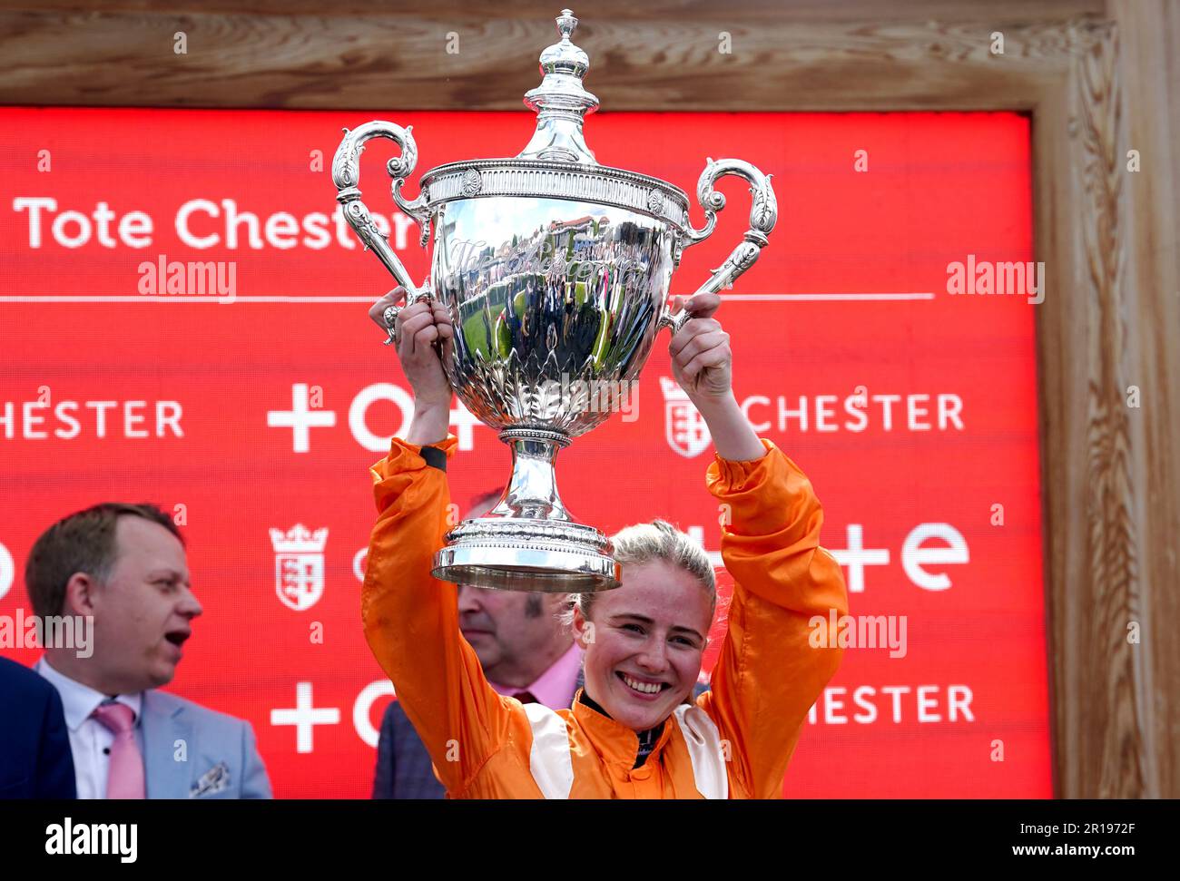 Jockey Saffie Osborne celebrates with The Chester Cup trophy after ...
