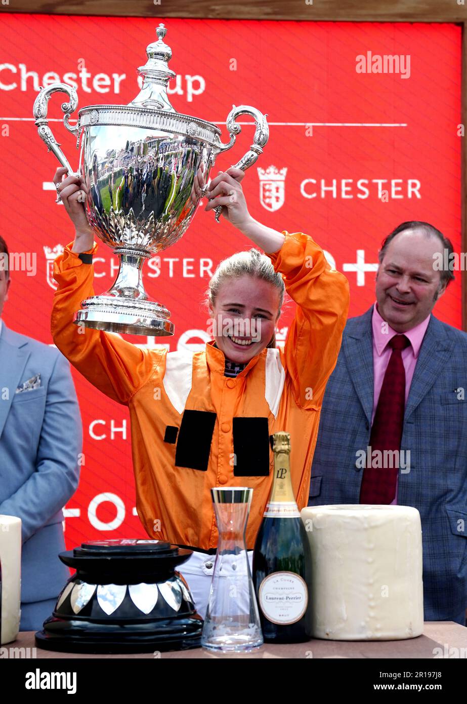 Jockey Saffie Osborne celebrates with The Chester Cup trophy after ...