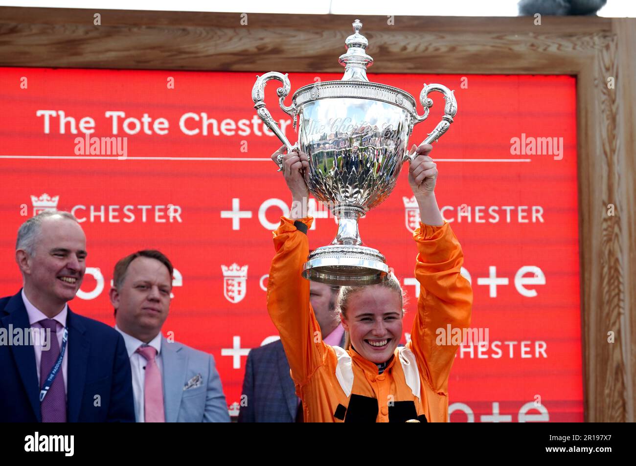 Jockey Saffie Osborne celebrates with The Chester Cup trophy after ...