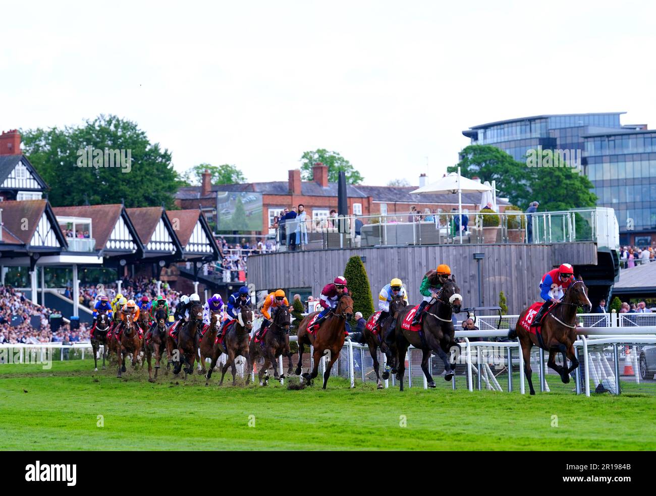 Runners and riders in action as they compete in the tote Chester Cup ...