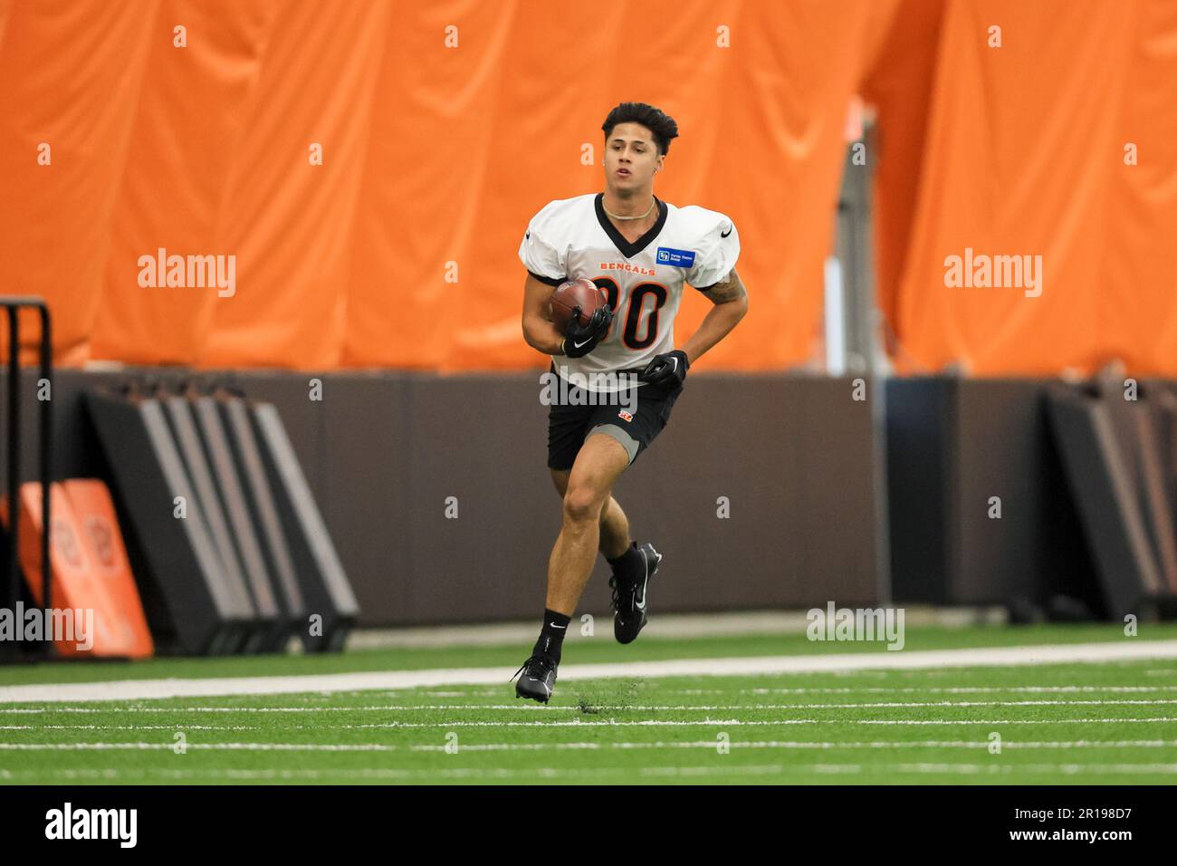 Cincinnati Bengals' Andrei Iosivas carries the ball as he takes part in ...