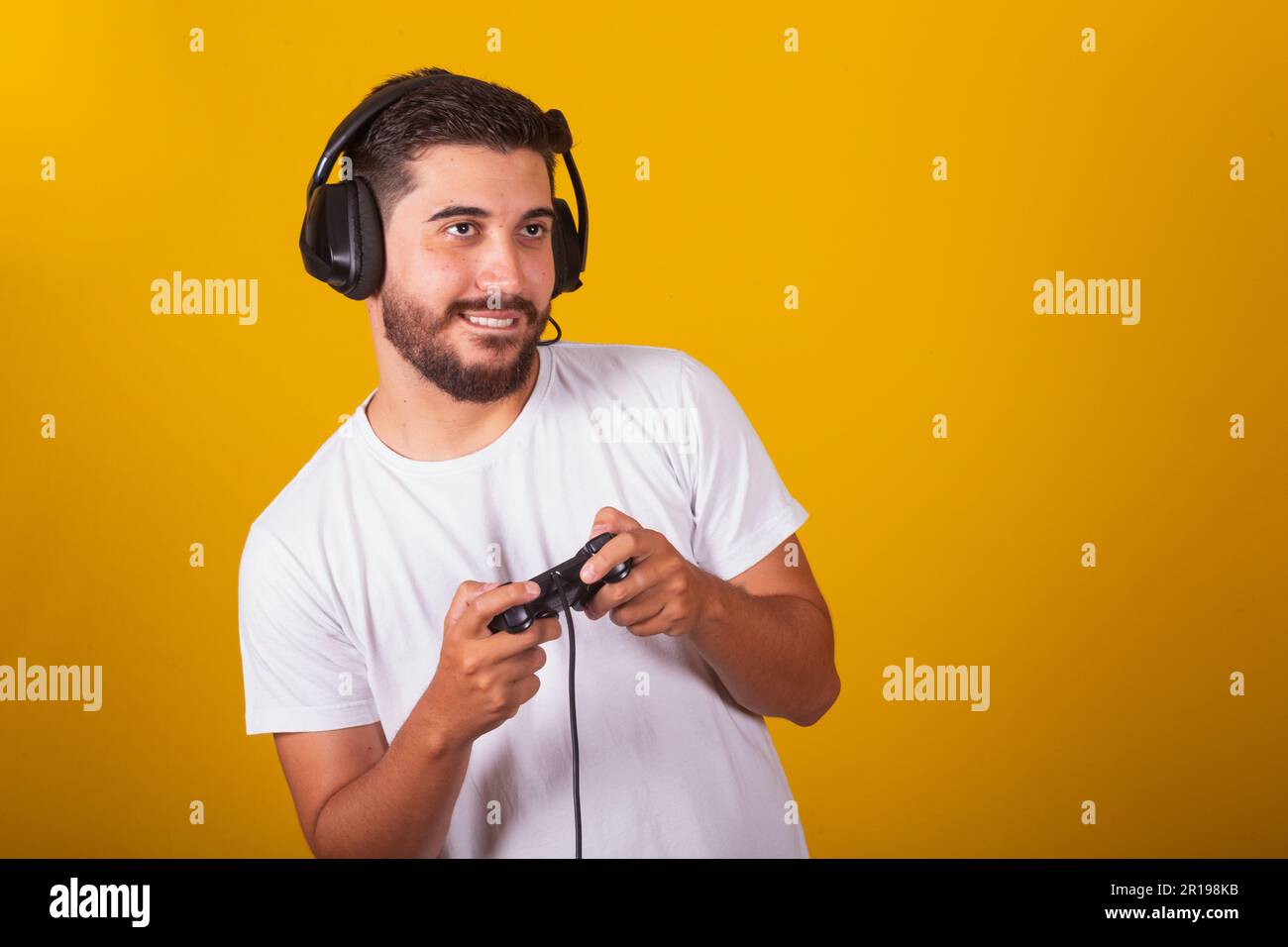 Happy Brazilian Latin American man with headset and video game ...