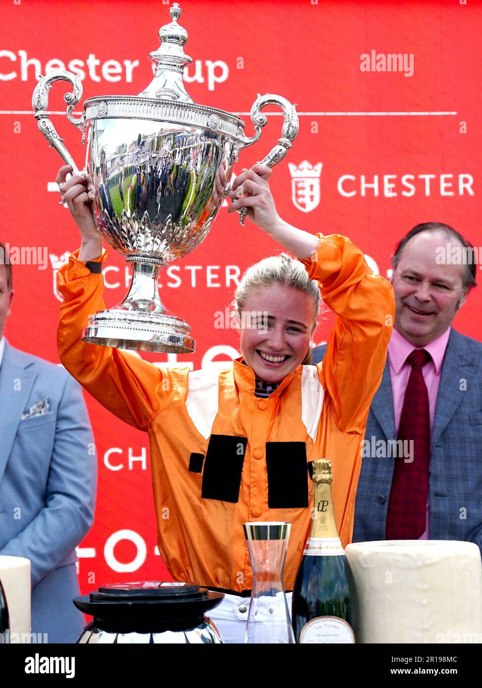 Jockey Saffie Osborne celebrates with The Chester Cup trophy after ...