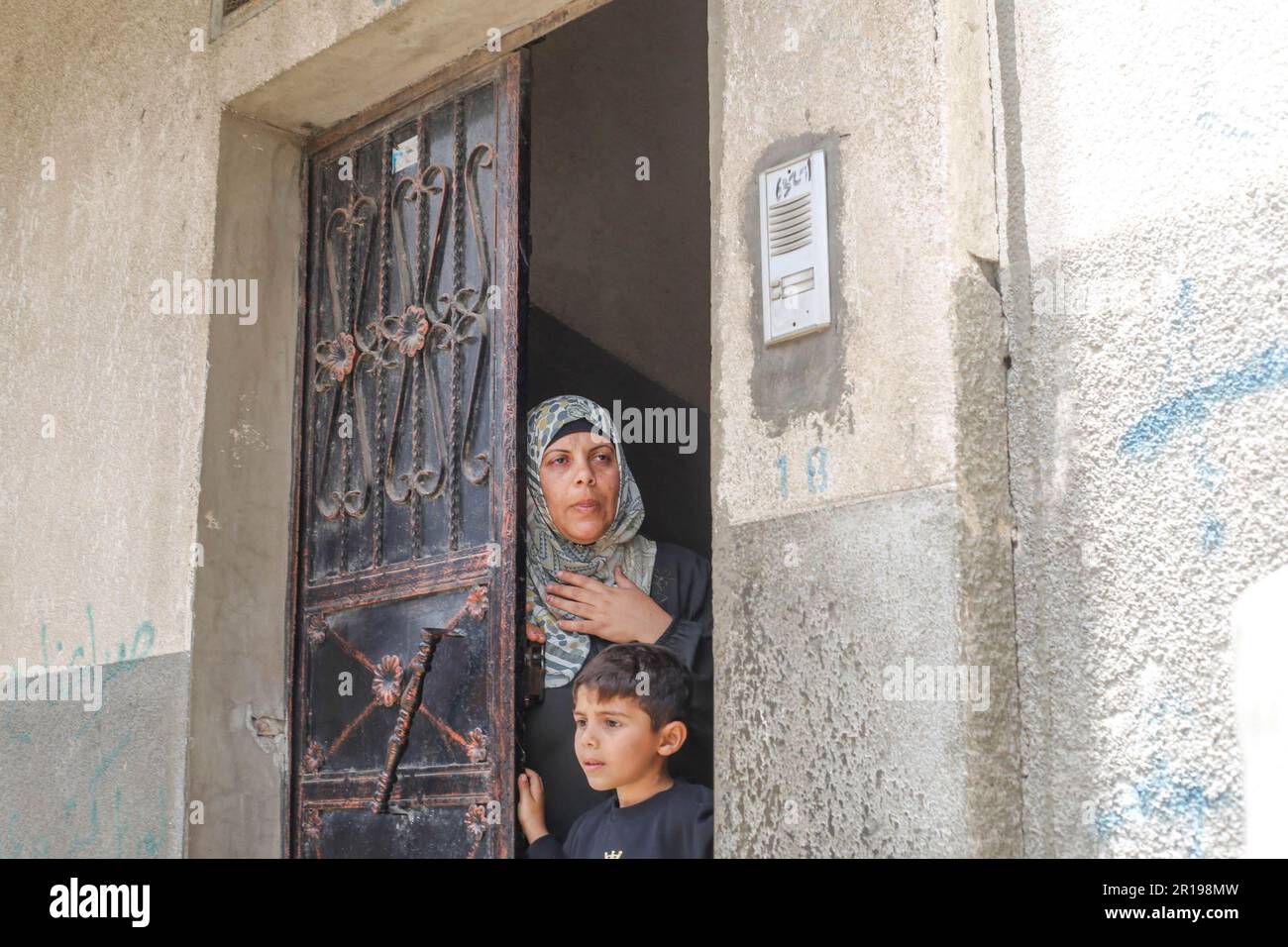 Gaza, Palestine. 12th May, 2023. A Palestinian woman reacts as she ...