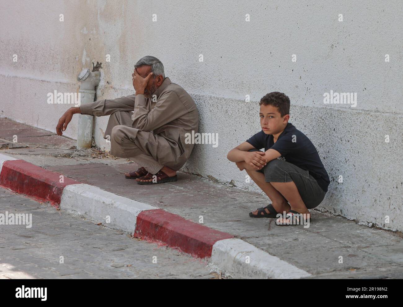 Gaza, Palestine. 12th May, 2023. An elderly Palestinian man cries as he ...