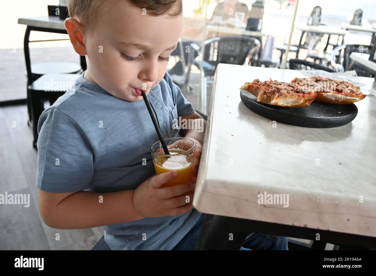 Nothing better than a good breakfast. A cute little boy eating toast ...