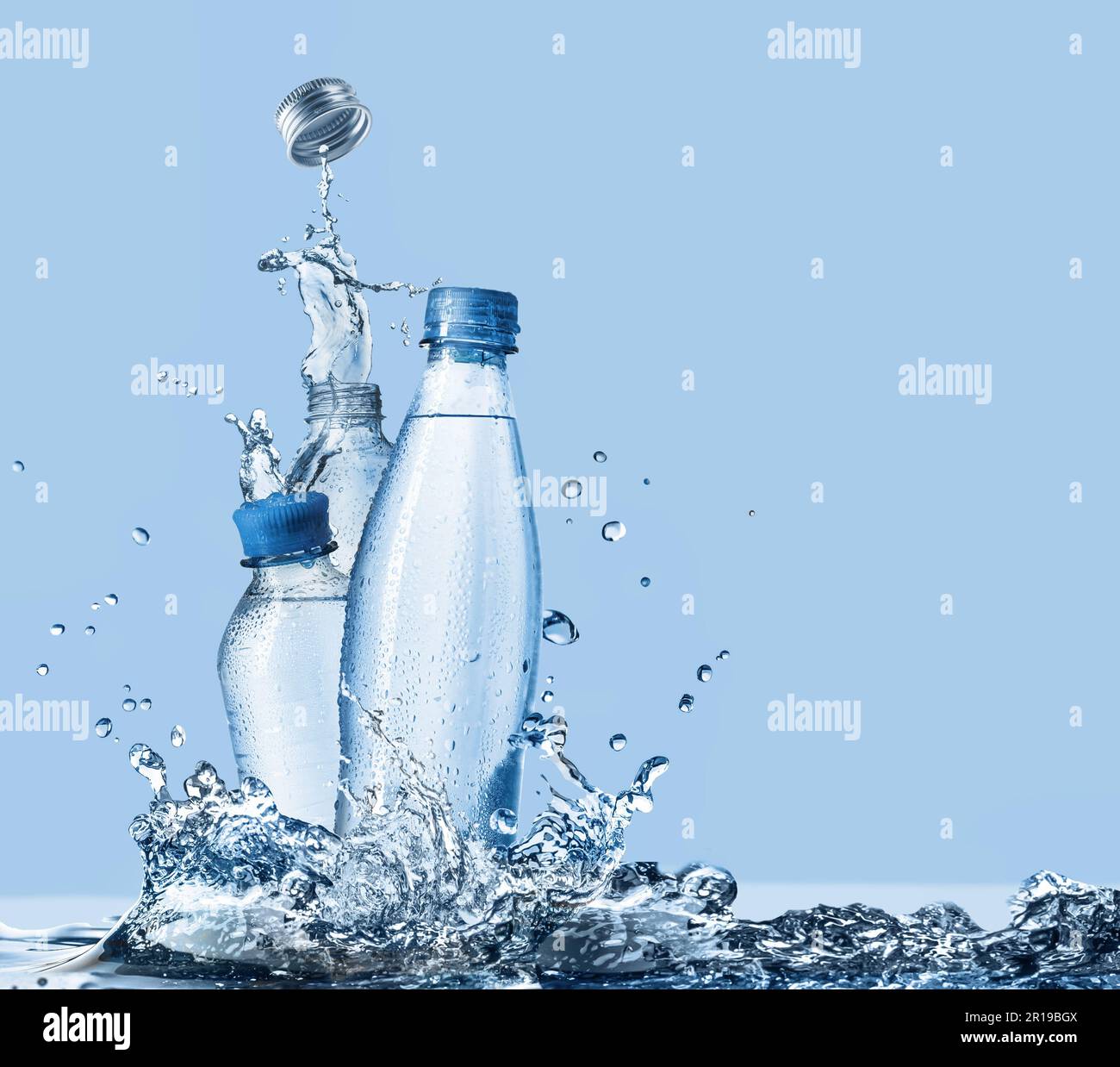 Plastic drinking water bottles and water splashes Stock Photo - Alamy