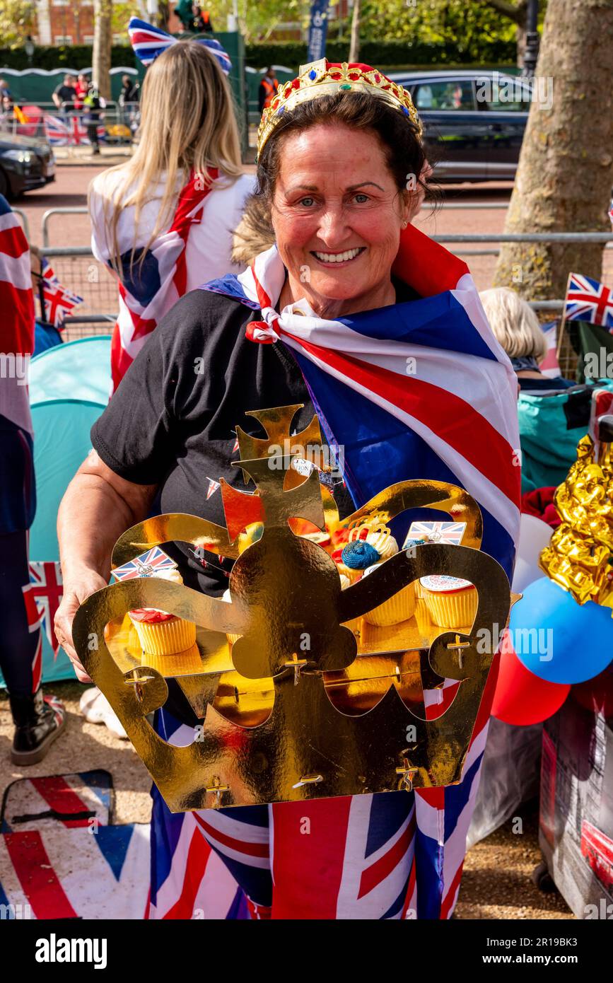 A Woman Holding A Plate of Cakes Before The Coronation of King Charles ...