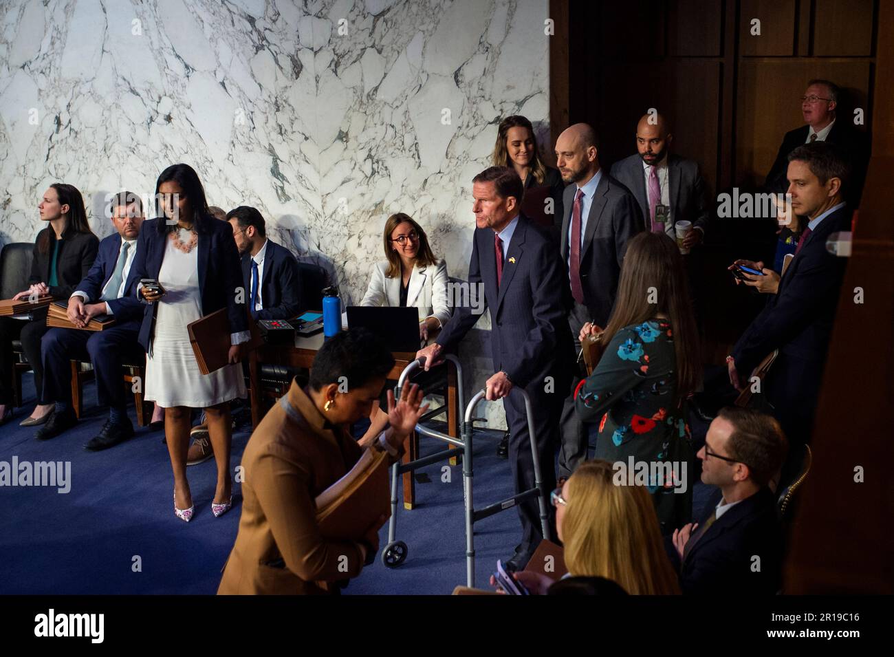 With the help of a walker, United States Senator Richard Blumenthal ...