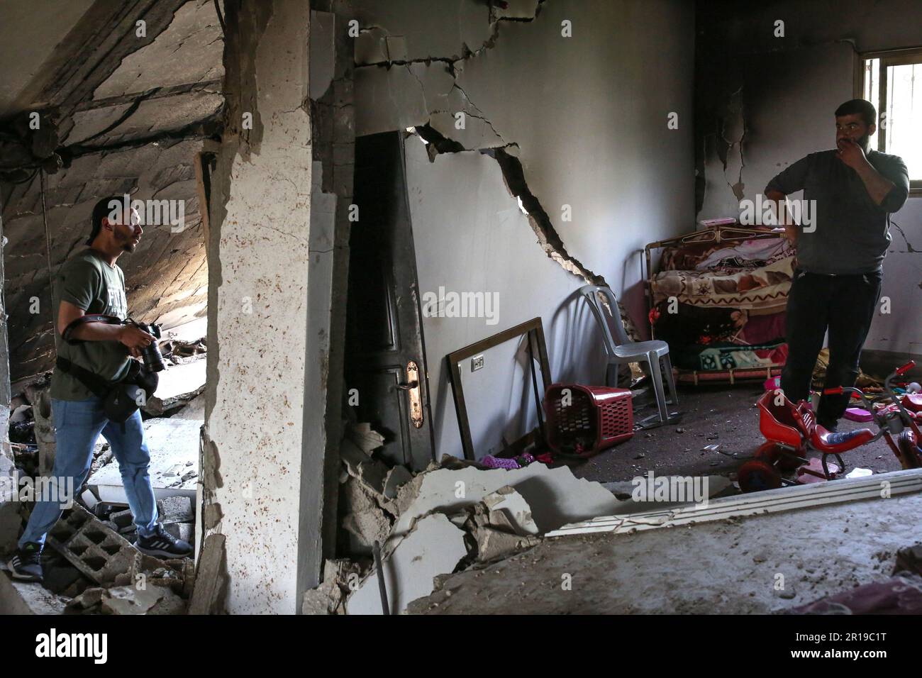 Gaza City, Gaza Strip, Palestine. 12th May, 2023. Zaher Bashir stands ...
