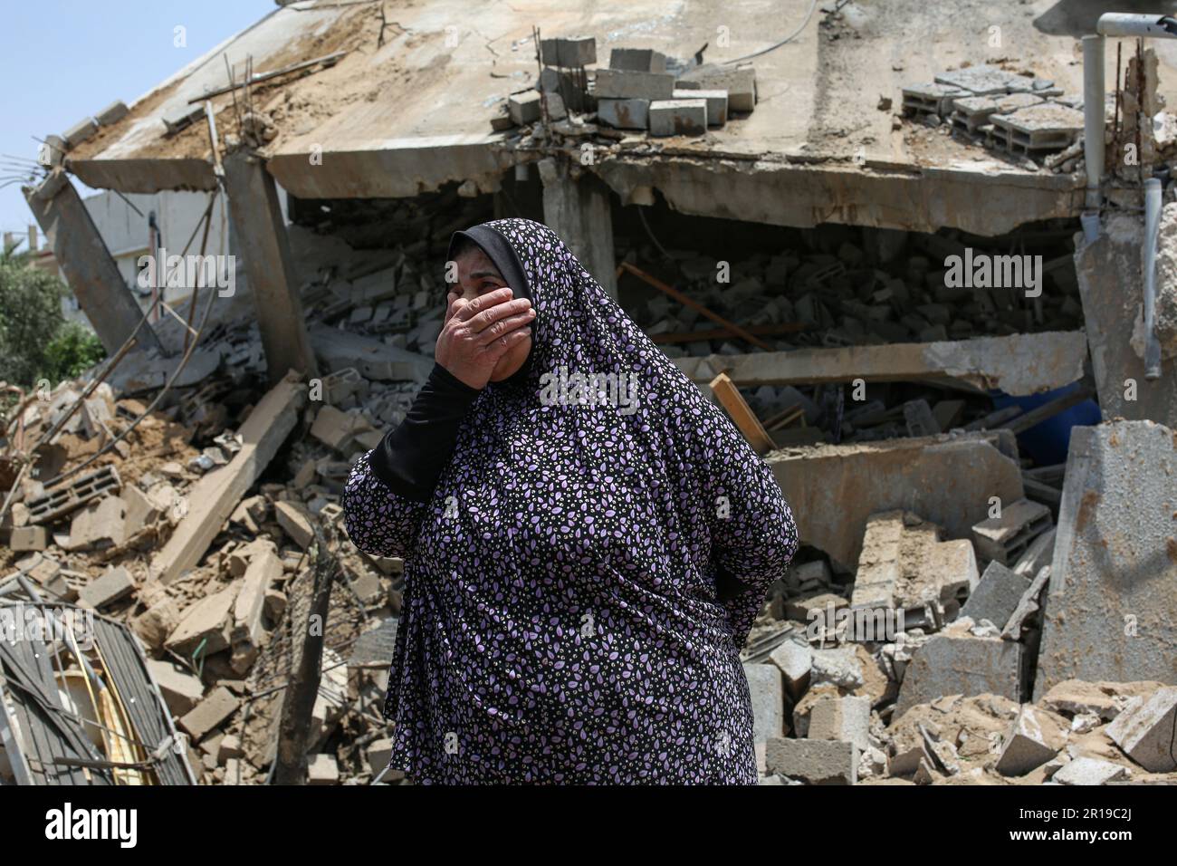 Gaza, Gaza Strip, Palestine. 12th May, 2023. Umm Zaher Bashir stands in ...