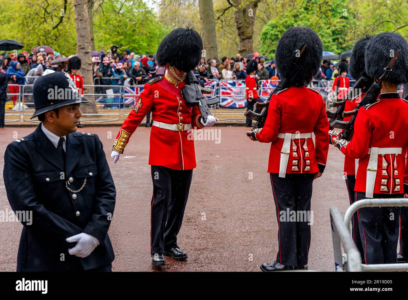 A Guardsman Inspects The Uniform of A Fellow Guard Before The King's ...