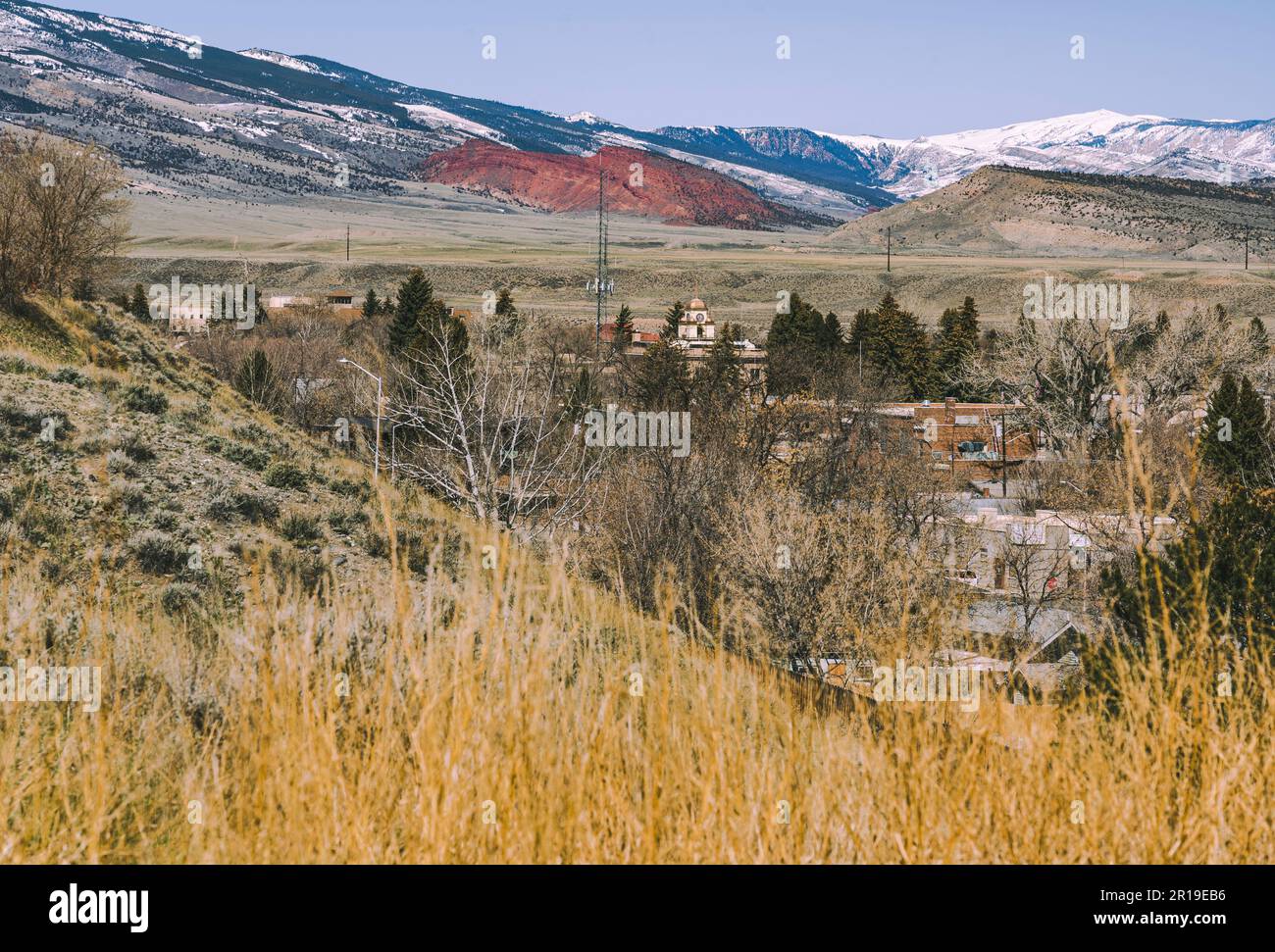 View of Red Butte, mountains and city hall in Cody, Wyoming, USA. This ...