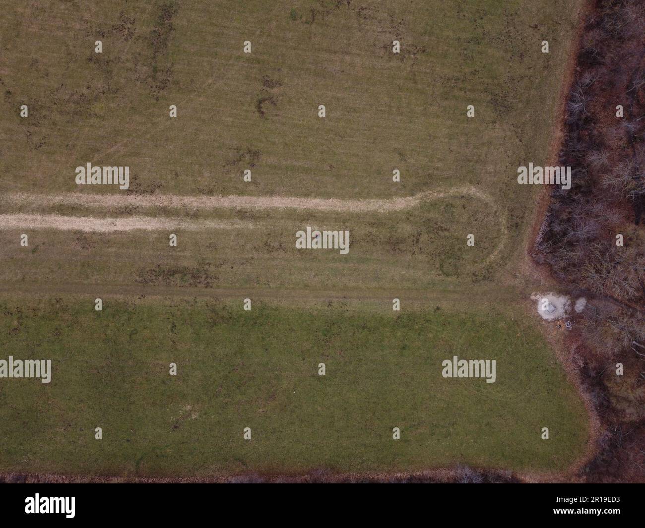 Aerial drone top to bottom view of green fields of Bad Urach in Germany ...