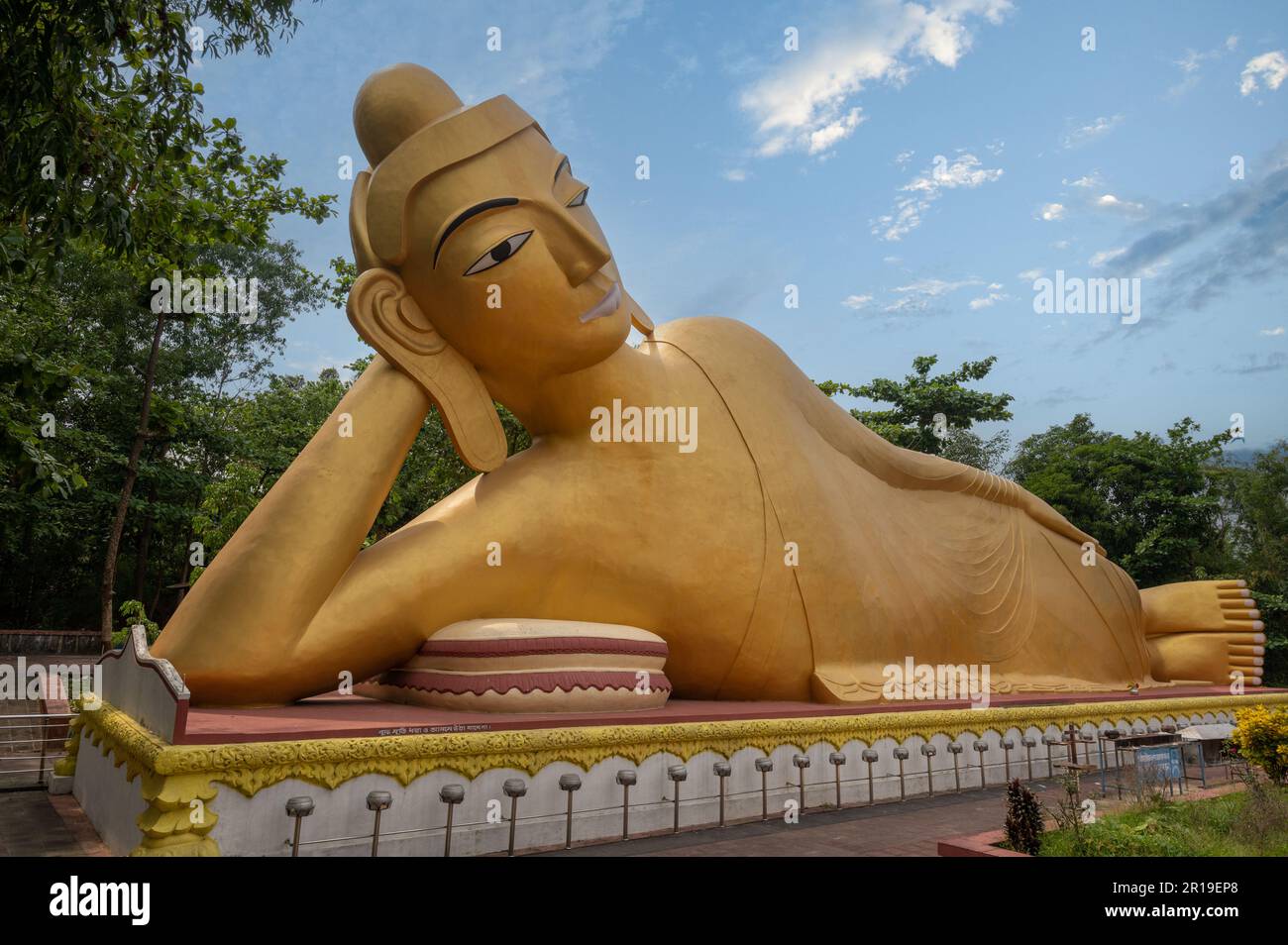 100 foot golden-coloured reclining statue of Lord Buddha, located at ...
