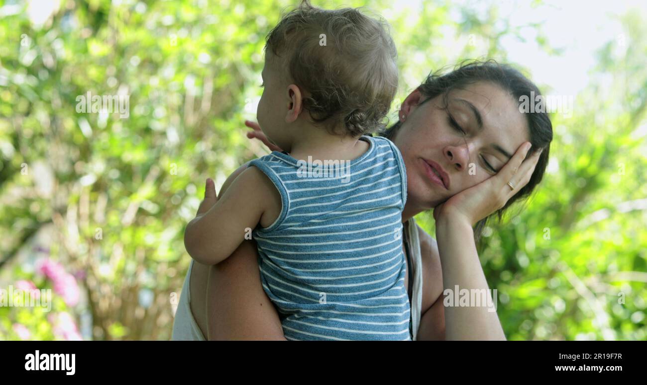 Tired mother baby outside hi-res stock photography and images - Alamy