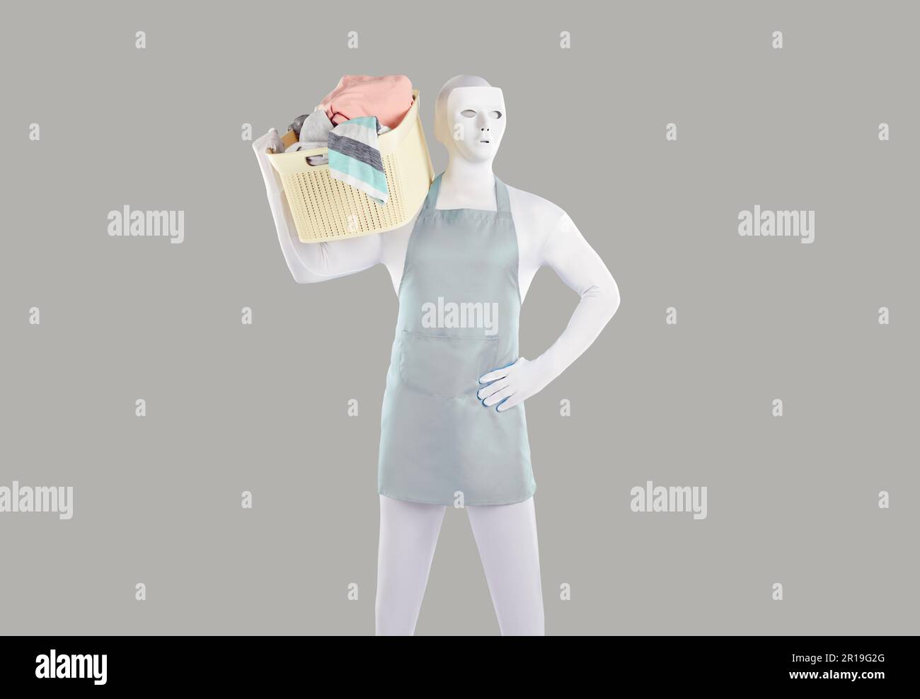 Man or android robot in white bodysuit and mask helping with housework ...