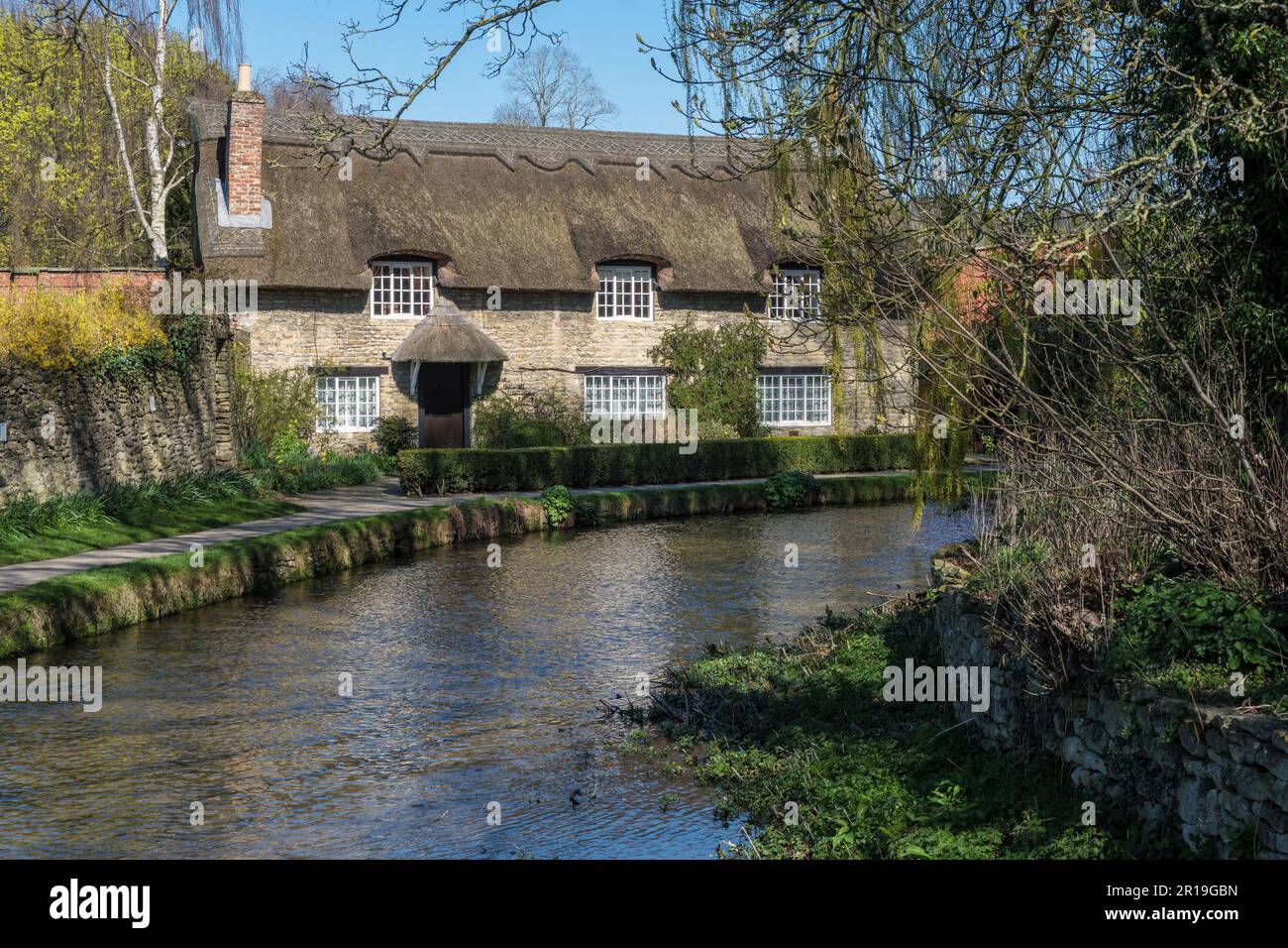 Beck Isle thatched cottage beside Thornton Beck in spring, Thornton le ...