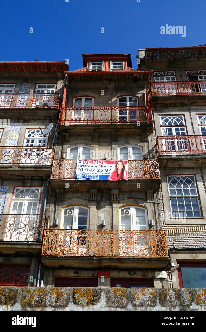 For sale sign on balcony of historic apartment building on the ...
