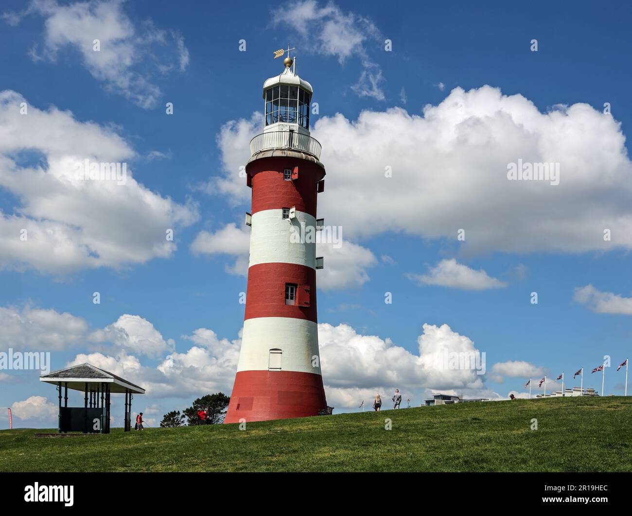 Smeatons Tower on Plymouth Hoe. Union Jacks fill the flag poles shortly ...