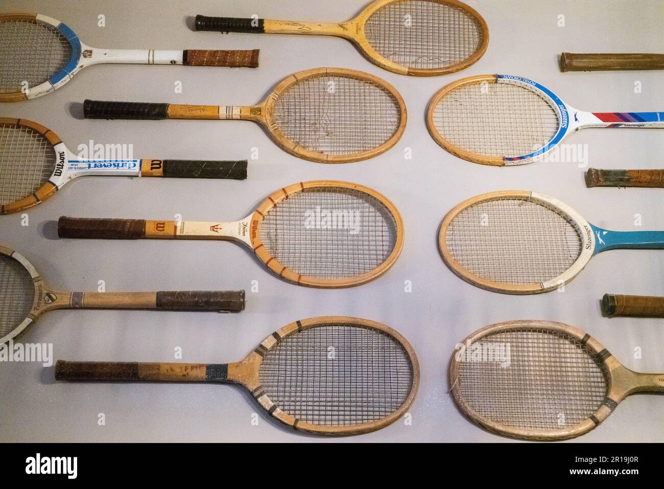 Old wooden tennis raquets hanging on a wall, London, UK Stock Photo - Alamy