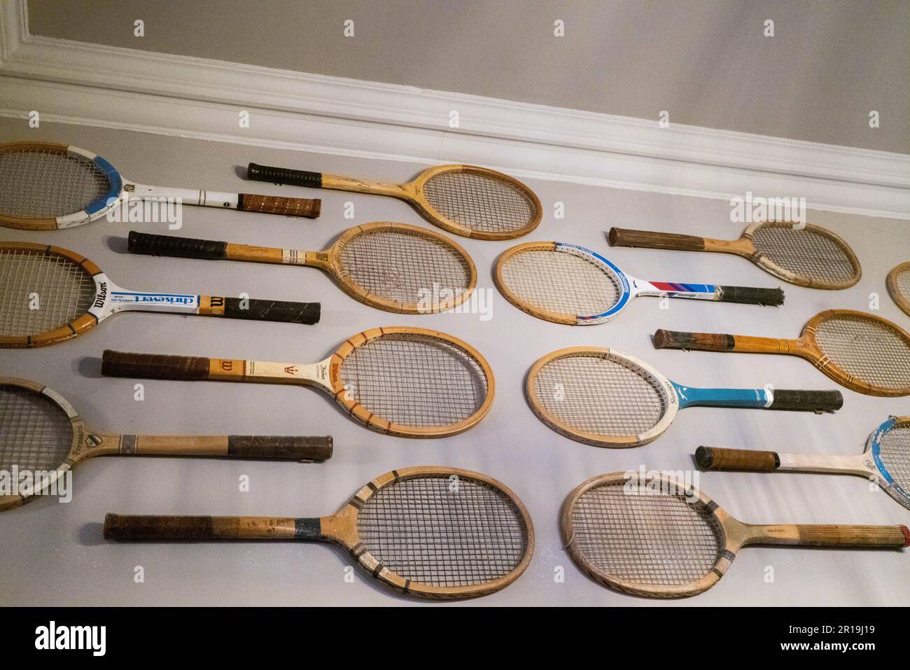 Old wooden tennis raquets hanging on a wall, London, UK Stock Photo - Alamy