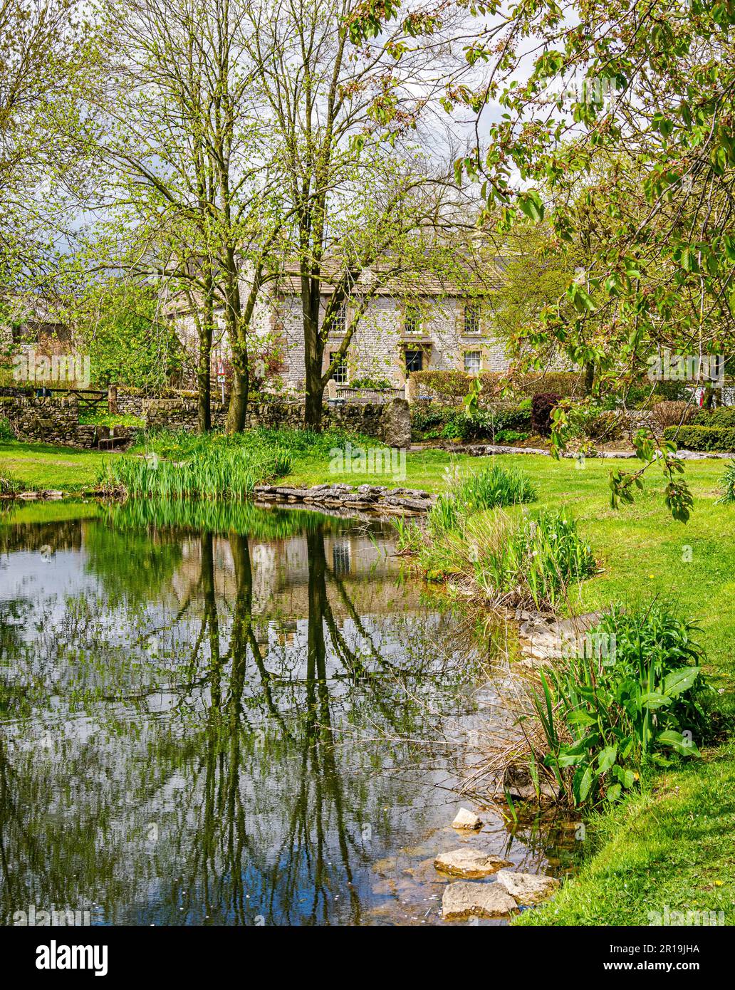 The village pond at Monyash in the Derbyshire Peak District in early ...
