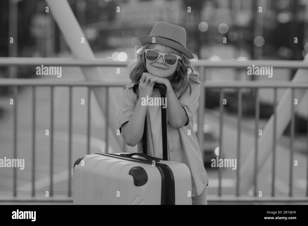 Funny child traveller. Child boy and travel suitcase. Kid with travel ...