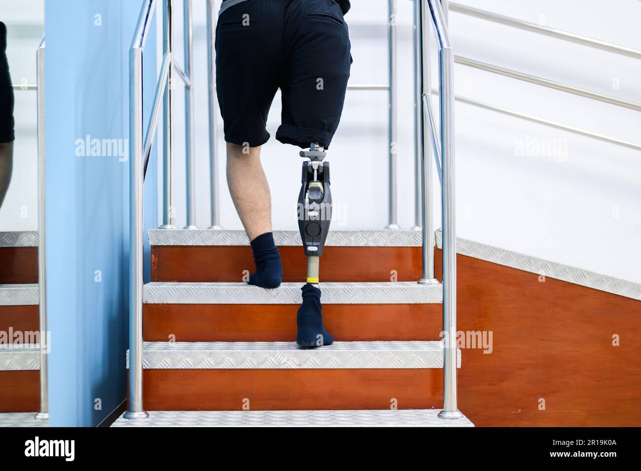 Disabled athlete patient with physical disability doing exercise Stock ...