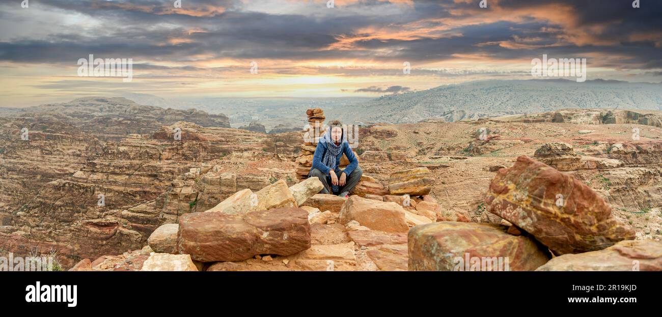Tourist posing in Petra Jordan on one of the Bedouin trails.Petra ...