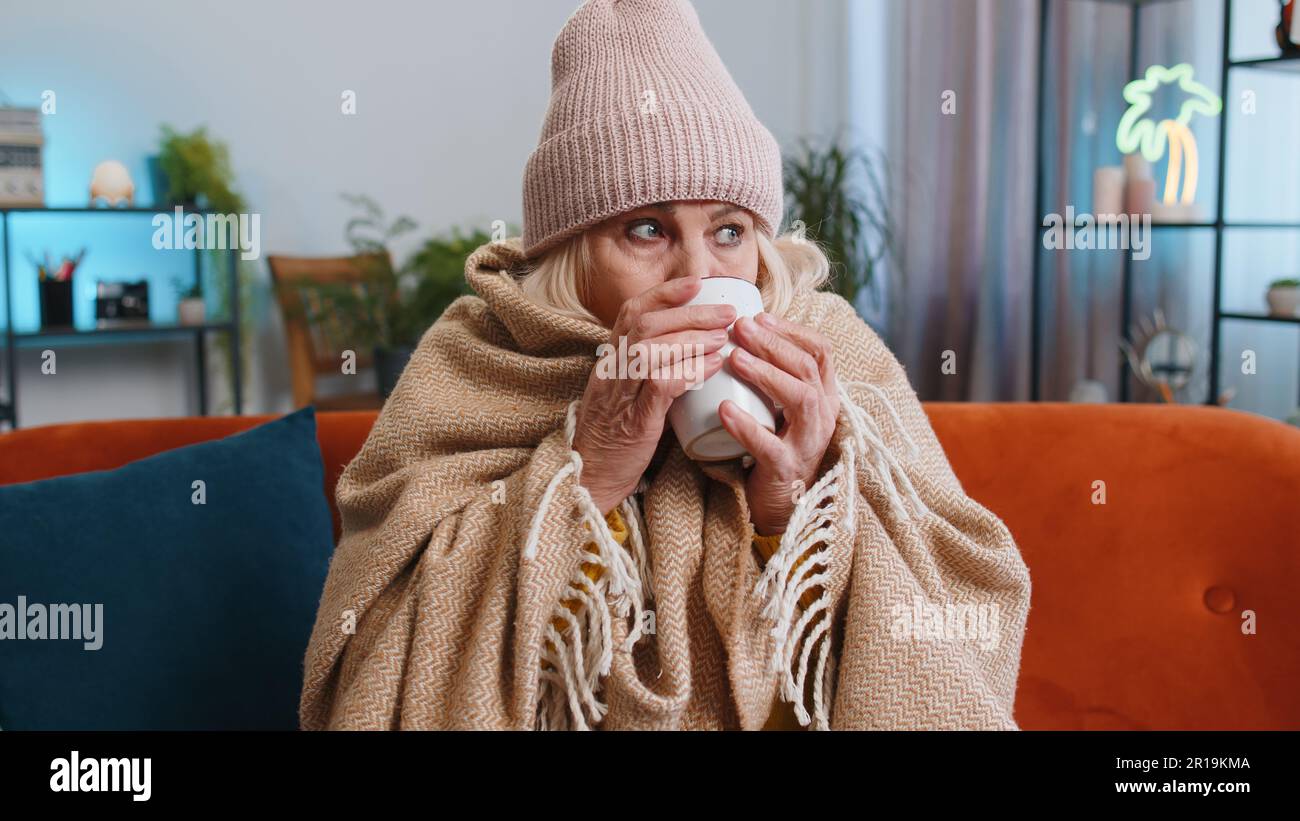 Mature woman shivering ill hi-res stock photography and images - Alamy