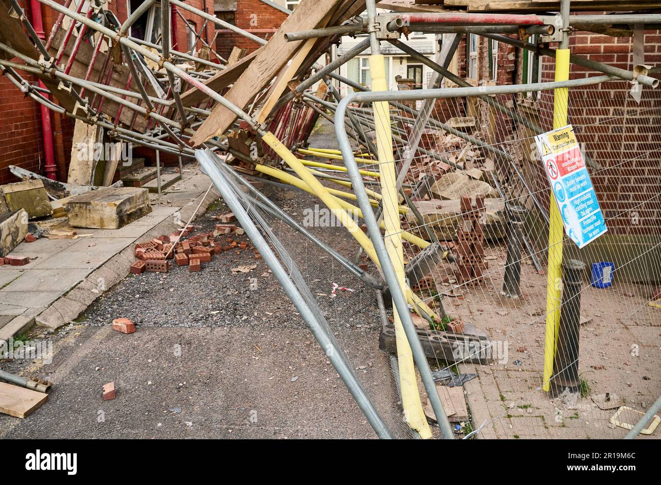 Building scaffold collapsed in alleyway Stock Photo - Alamy