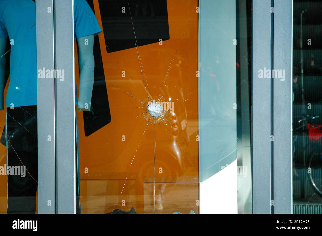 A clothing store damaged window display in a city street Stock Photo ...