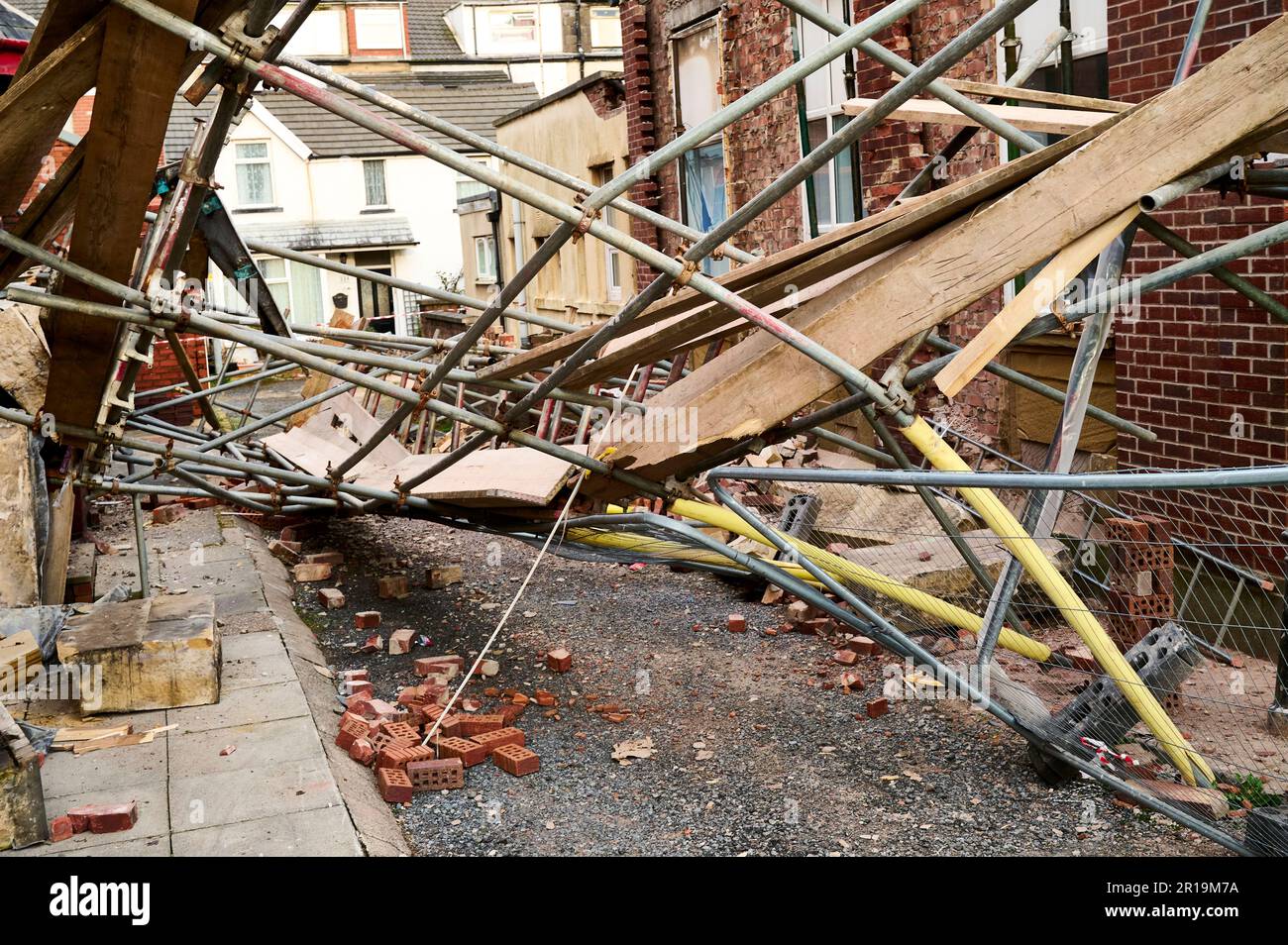 Building scaffold collapsed in alleyway Stock Photo - Alamy