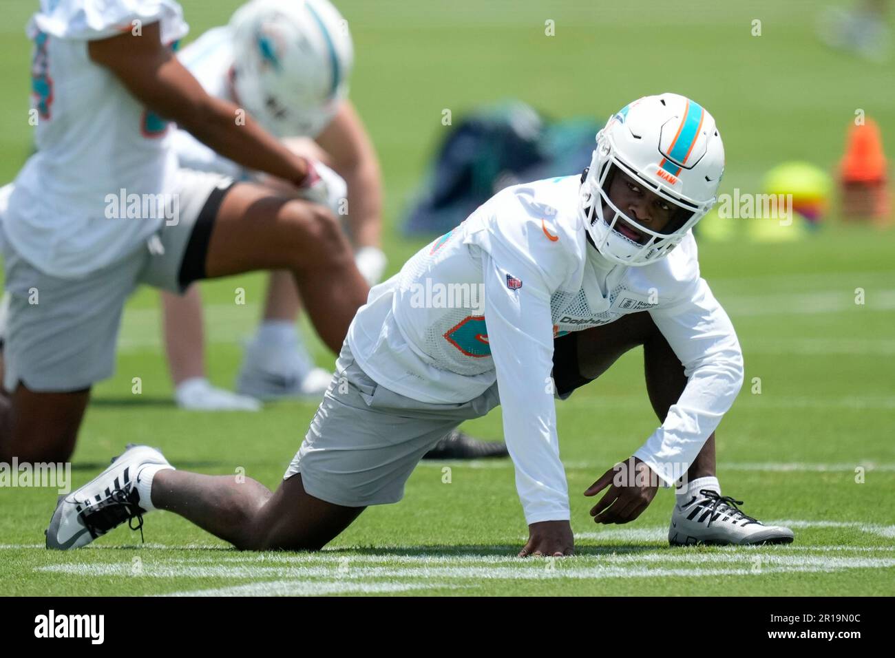 Miami Dolphins running back Devon Achane stretches during the NFL ...