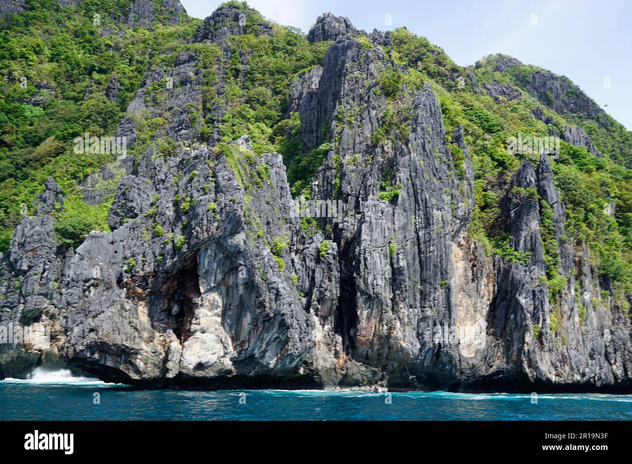massive limestone rocks in the blue sea at the el nido archipelago ...