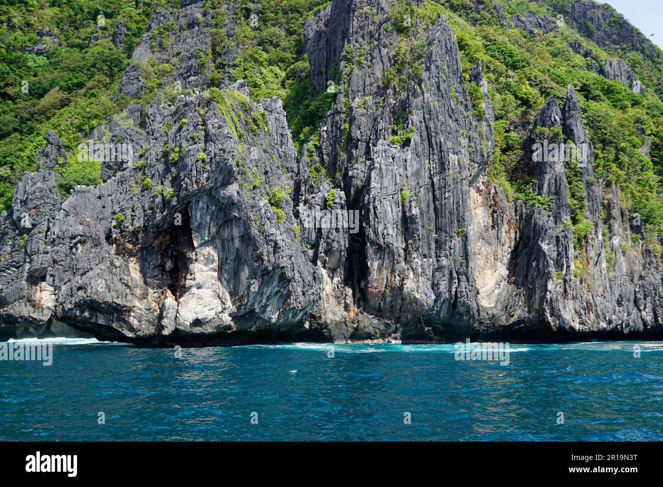 massive limestone rocks in the blue sea at the el nido archipelago ...