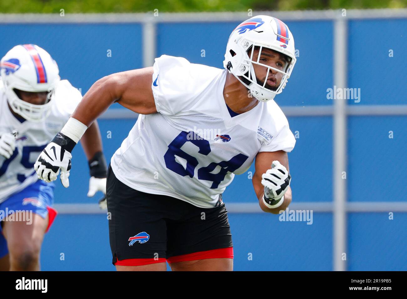 Buffalo Bills offensive lineman O'Cyrus Torrence (64) runs a drill ...