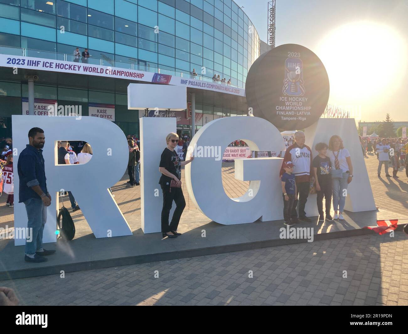 Riga, Latvia. 12th May, 2023. Fans pose for photos in front of a Riga ...